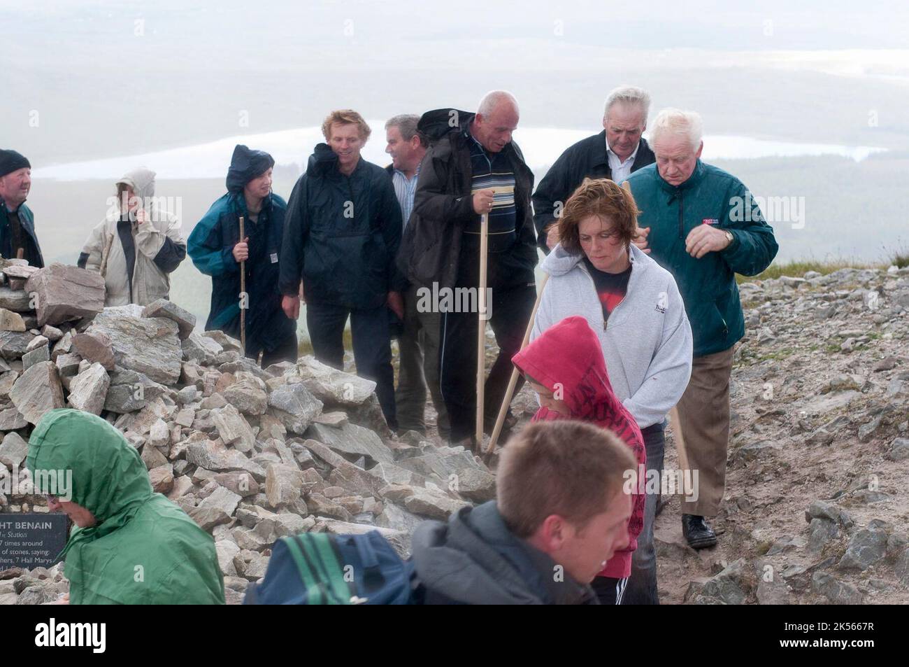 People walk around a stone pile 7 times on Croagh Patrick on Reek ...