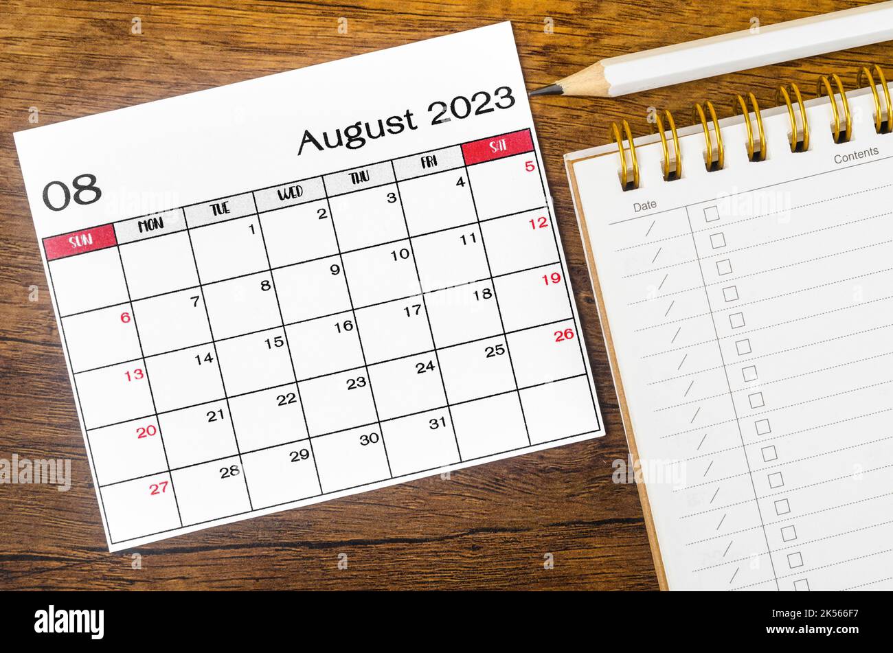 August 2023 Monthly calendar for 2023 year with open diary on wooden ...