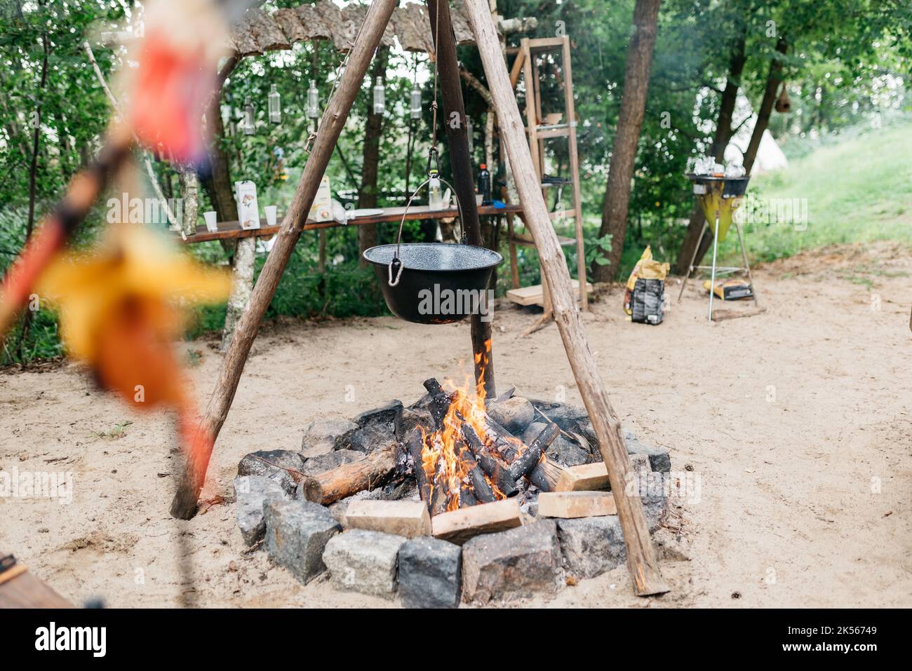 cooking food over a fire in a pot Stock Photo - Alamy