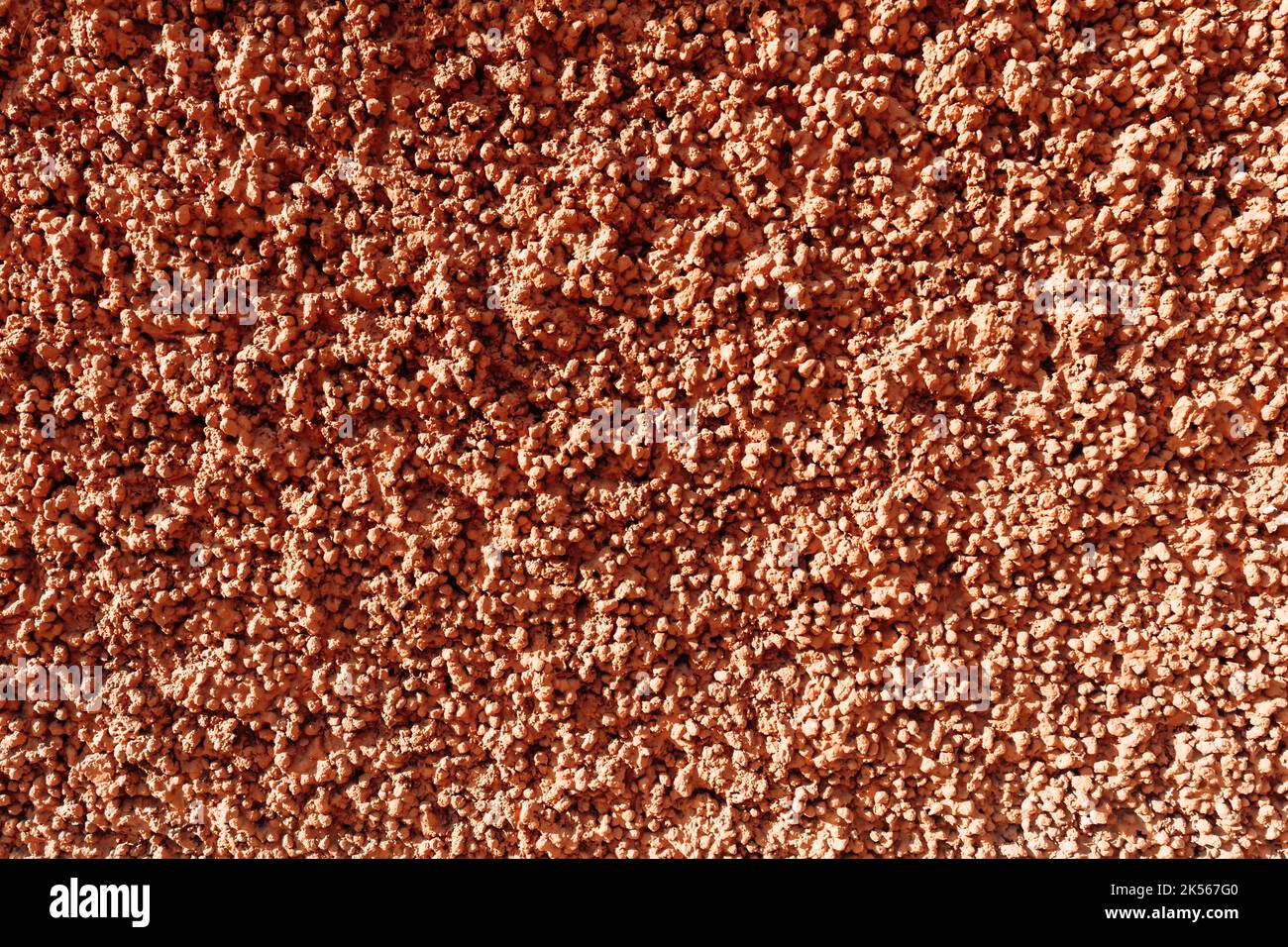 Expanded clay concrete texture. Red pink relief plaster, consisting of ...