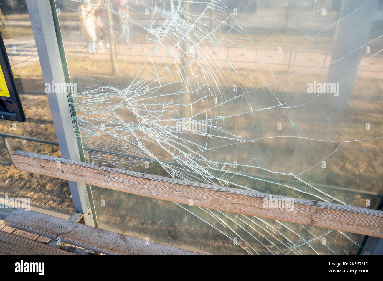 Cracks on glass railing or wall at public transport stop. Closeup Stock ...