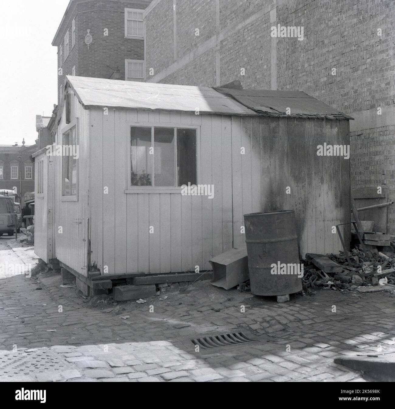 1960s, historical, side-view of a workman's wooden hut, with windows ...