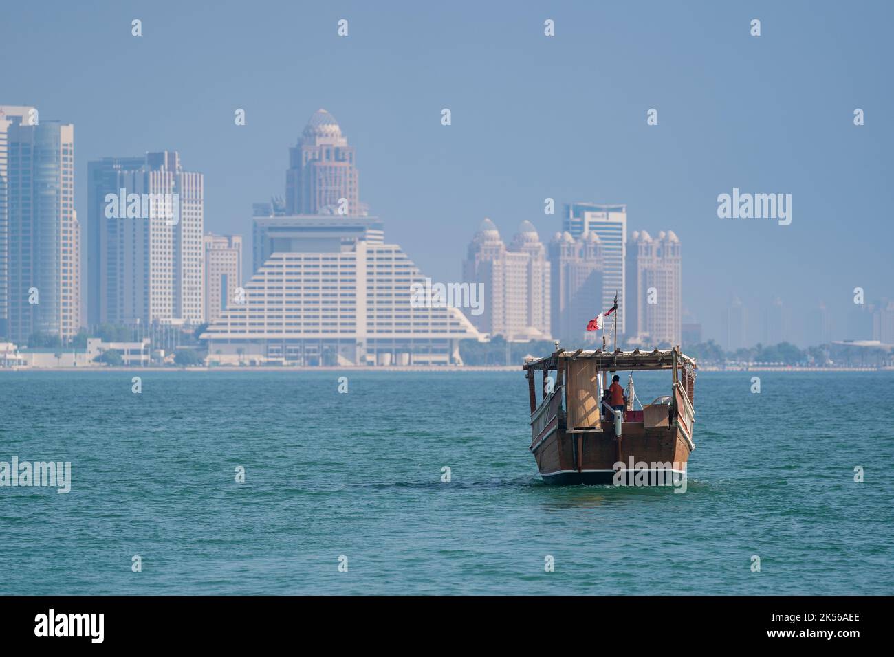 Traditional dhow and seafront of Doha West Bay skyline on background ...