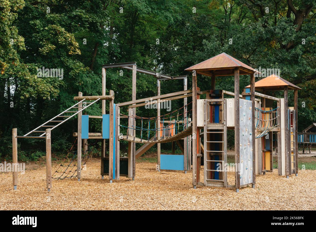 Children's wooden playground recreation area at public park. Children's ...