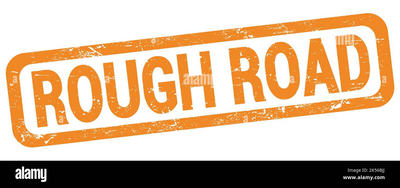 ROUGH ROAD text written on orange rectangle stamp sign Stock Photo - Alamy