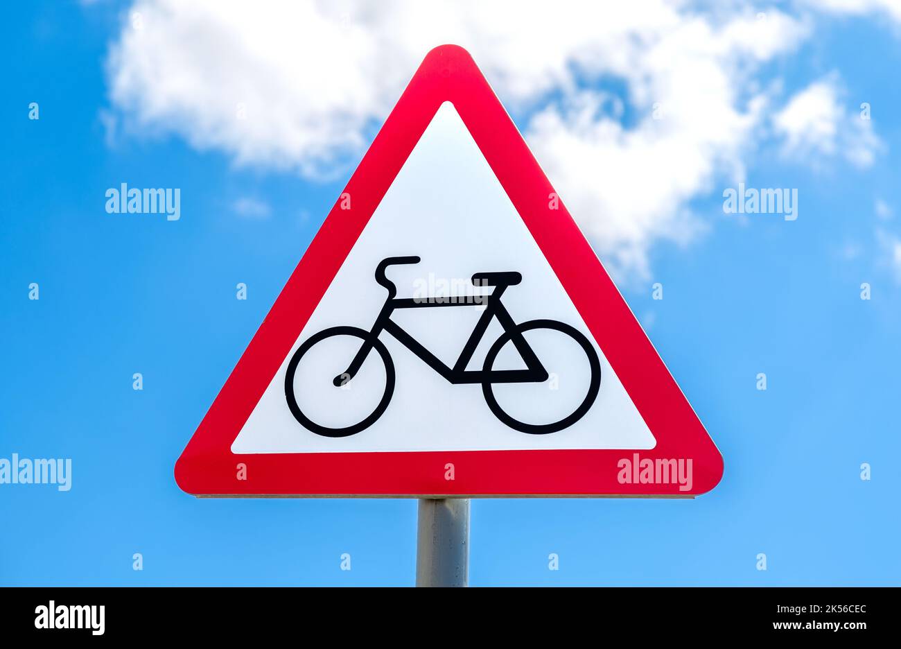 Triangle bicycle road sign for bikes lane against the blue sky Stock ...