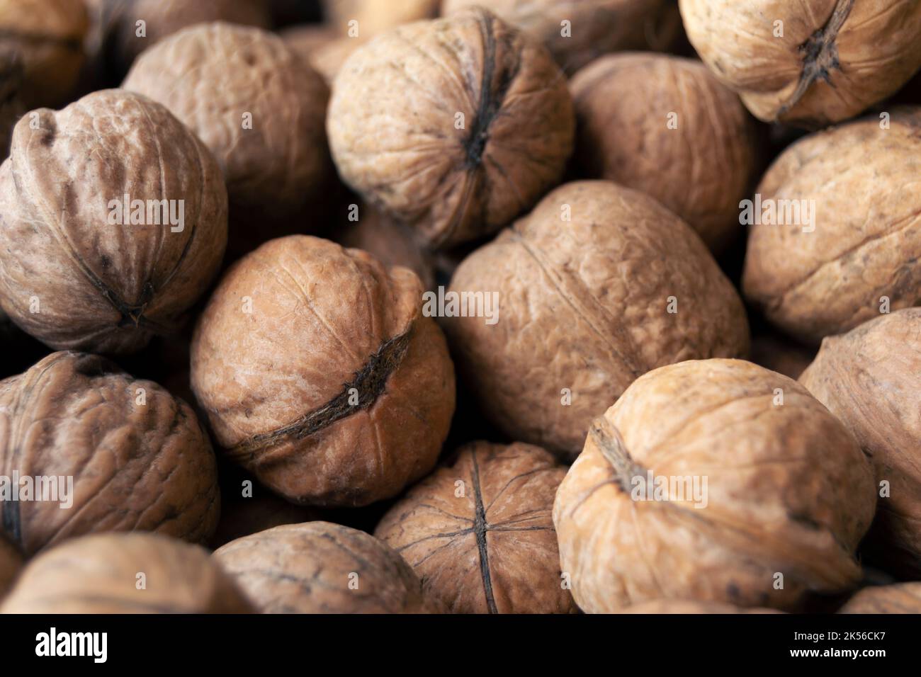 Pile of raw walnuts close-up as background Stock Photo - Alamy