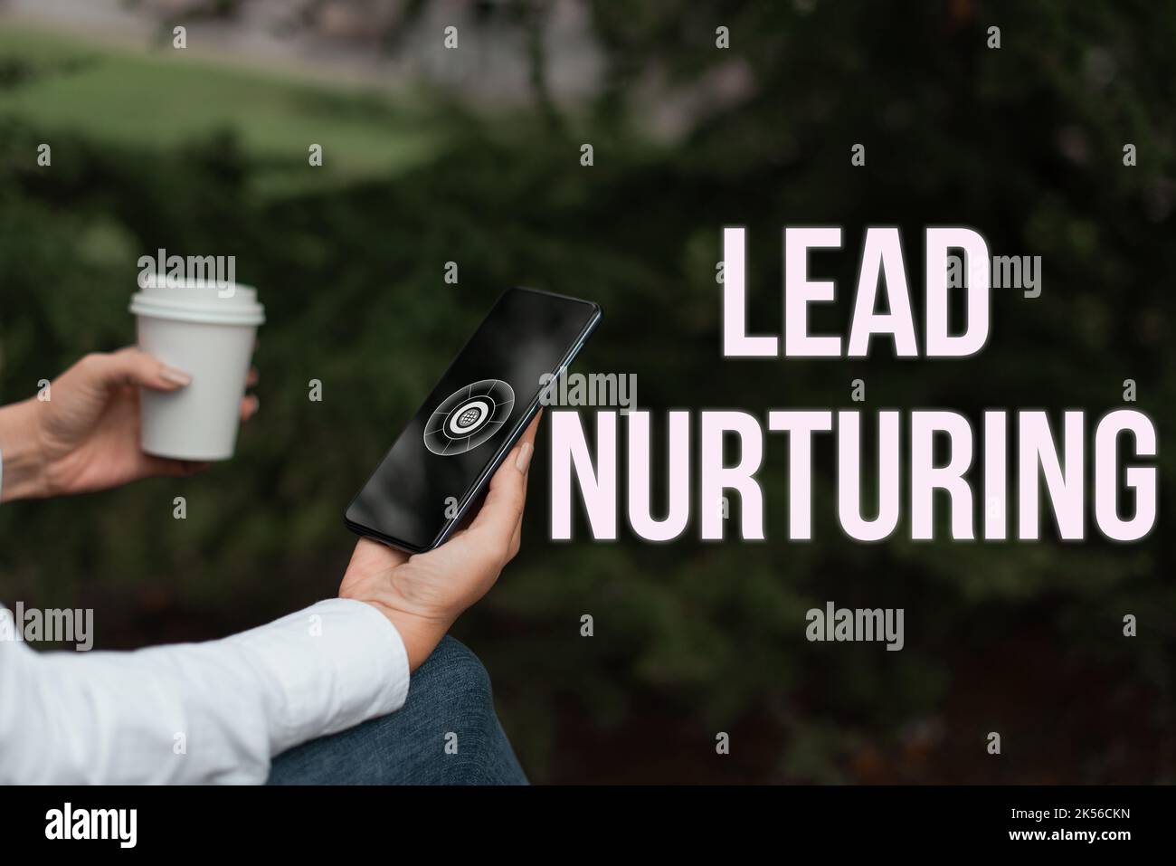 Hand writing sign Lead Nurturing, Word Written on method of building a ...