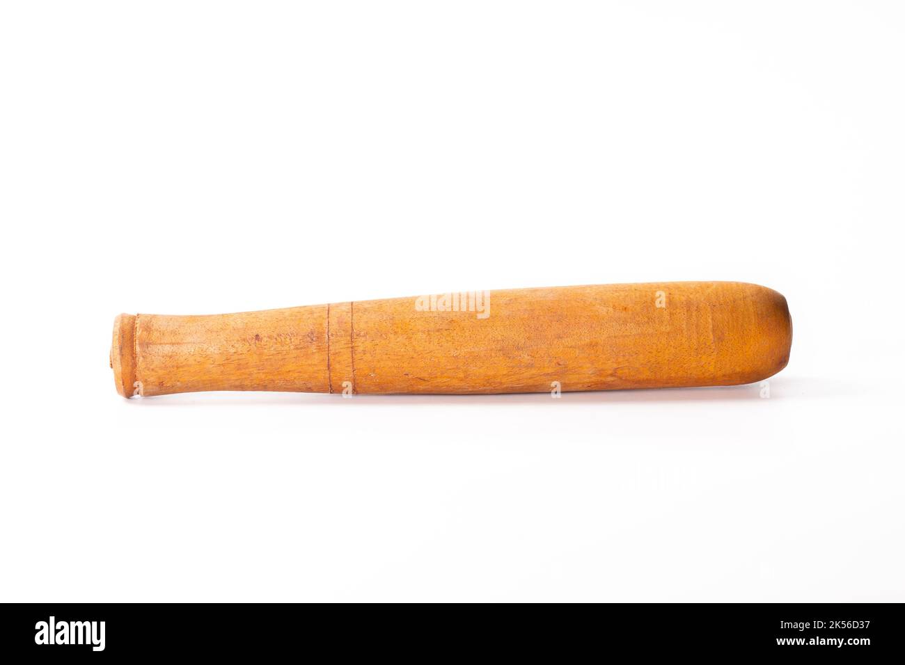 wooden pestle is often used with a mortar. isolated on a white ...