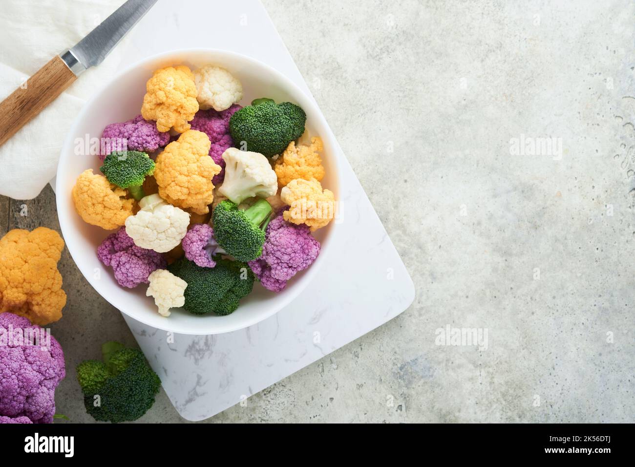 Colorfu cauliflower. Cauliflower cut into small pieces white bowl on ...