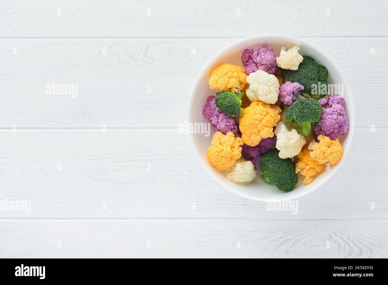 Colorfu cauliflower. Cauliflower cut into small pieces white bowl on ...