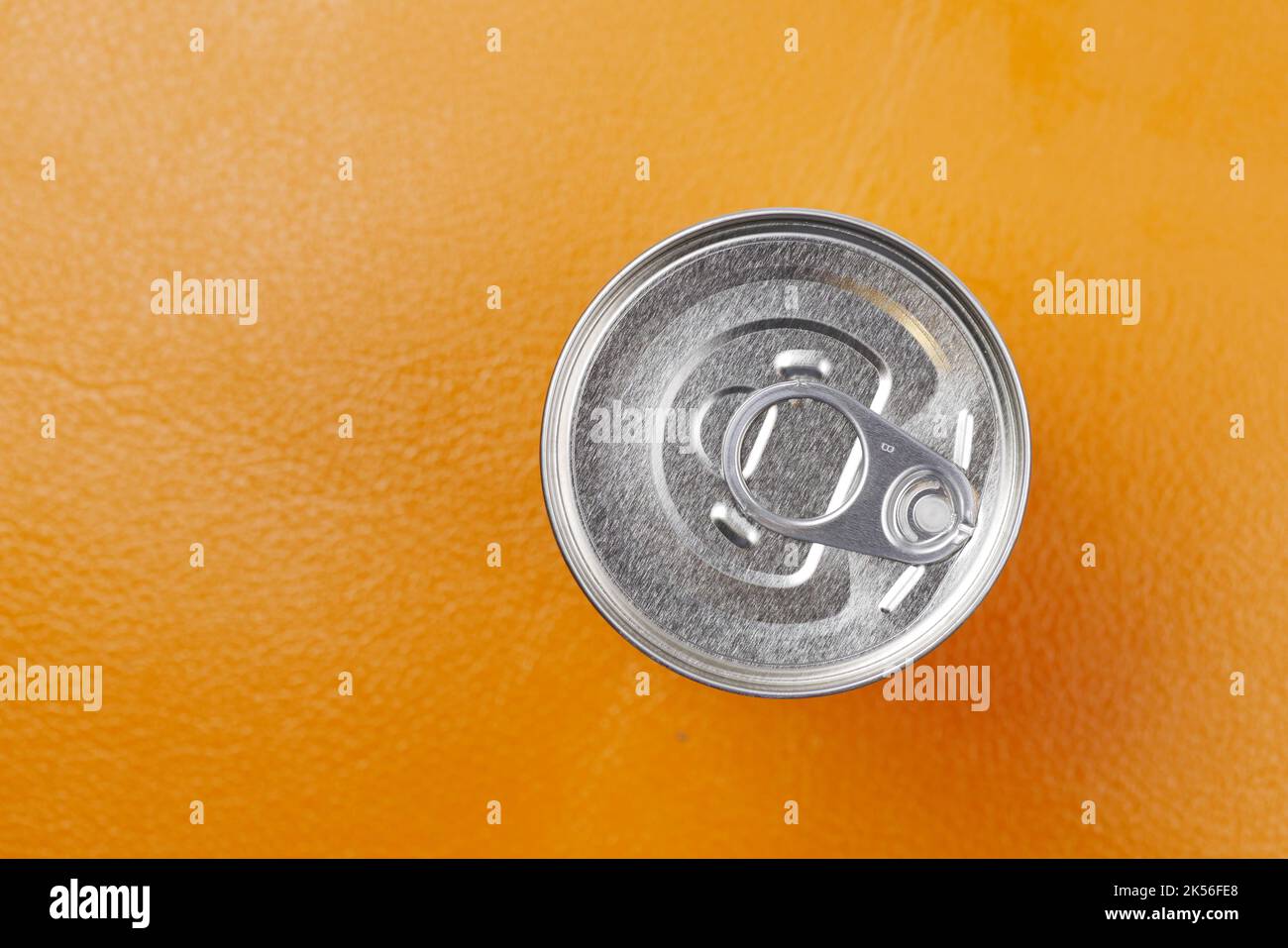close up of a food can on orange background Stock Photo - Alamy