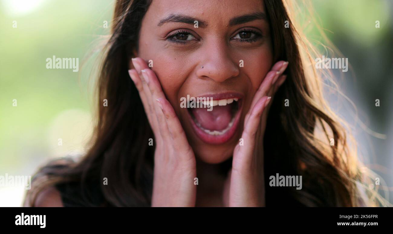 Ecstatic hispanic latina woman amazed emotion Stock Photo - Alamy