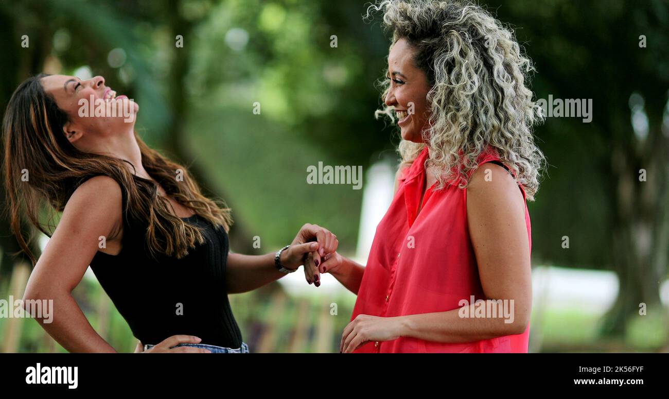 Candid women laughing together, person real life laugh and smile ...