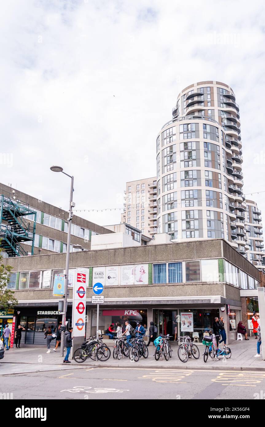 Pedestrians walk past independent shops on Station Parade in Barking ...