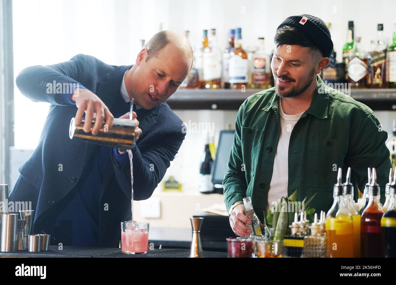 The Prince of Wales pours a drink during a cocktail making competition ...