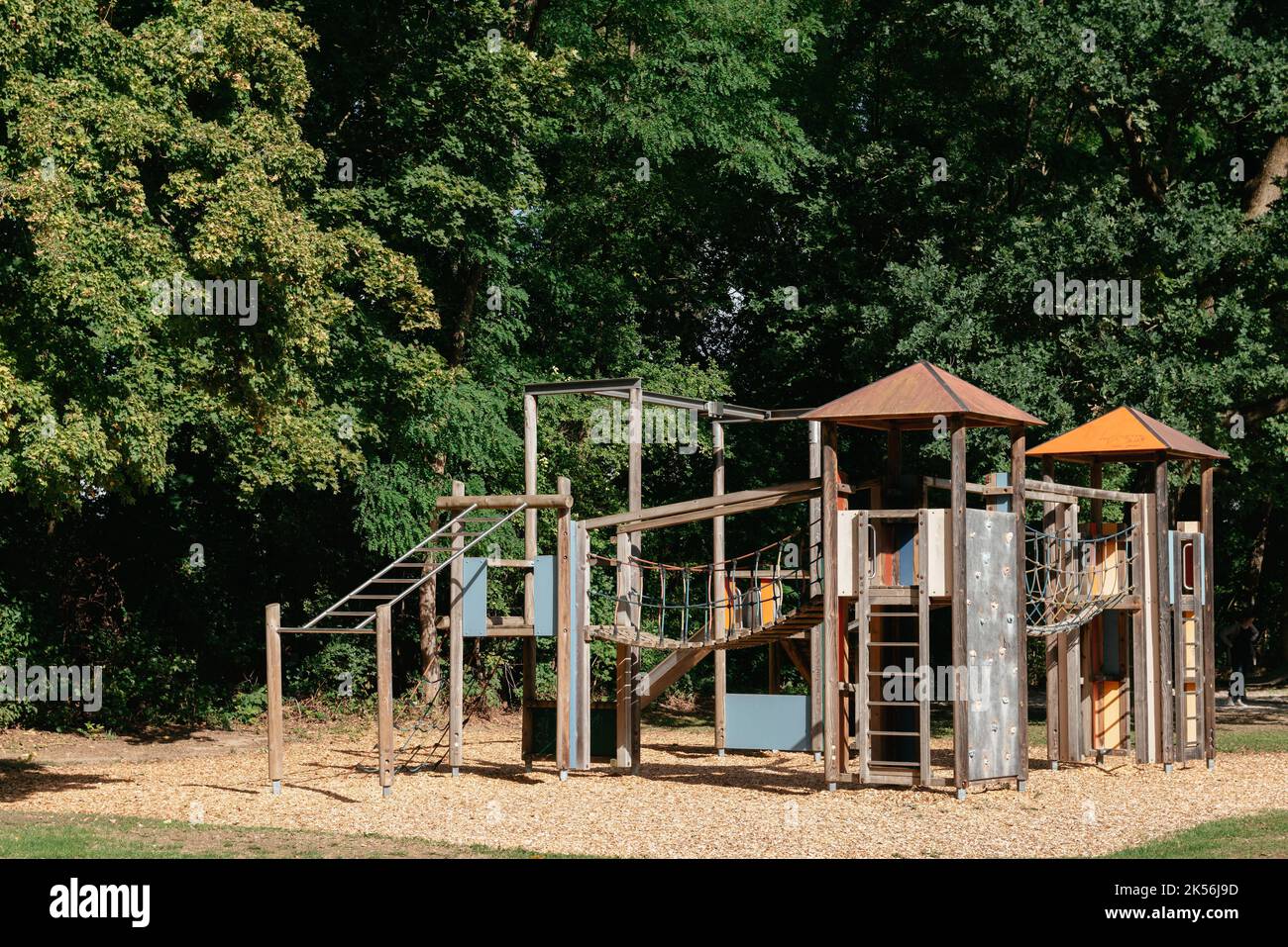 Children's wooden playground recreation area at public park. Children's ...