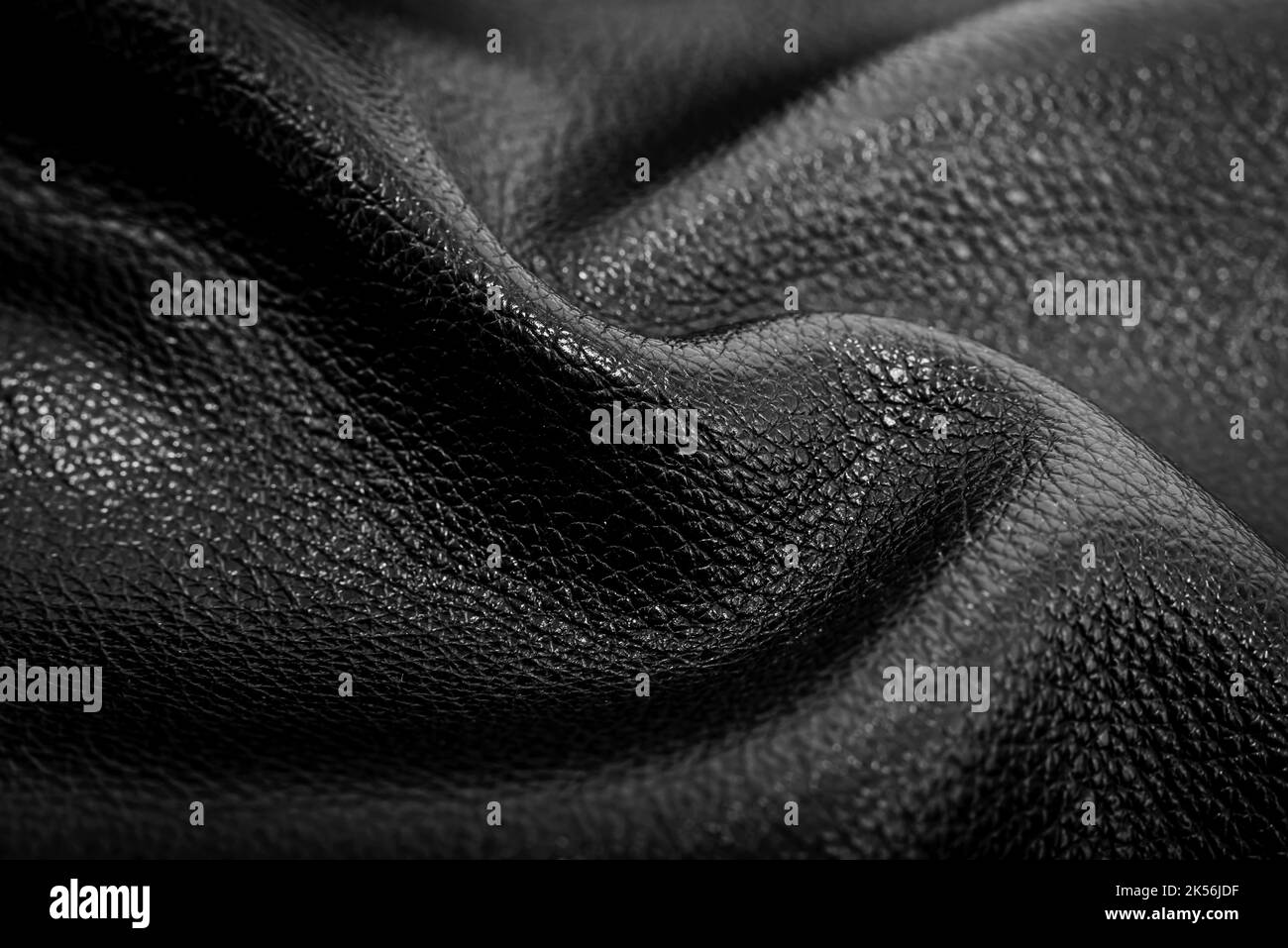 Black leather texture. Abstract background of dark leather with small ...
