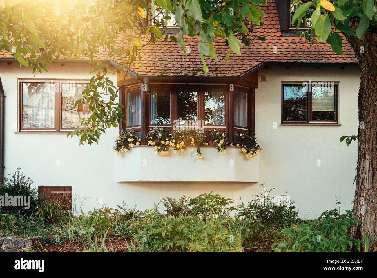 Traditional small house with beautiful outdoor decor facade in Germany ...