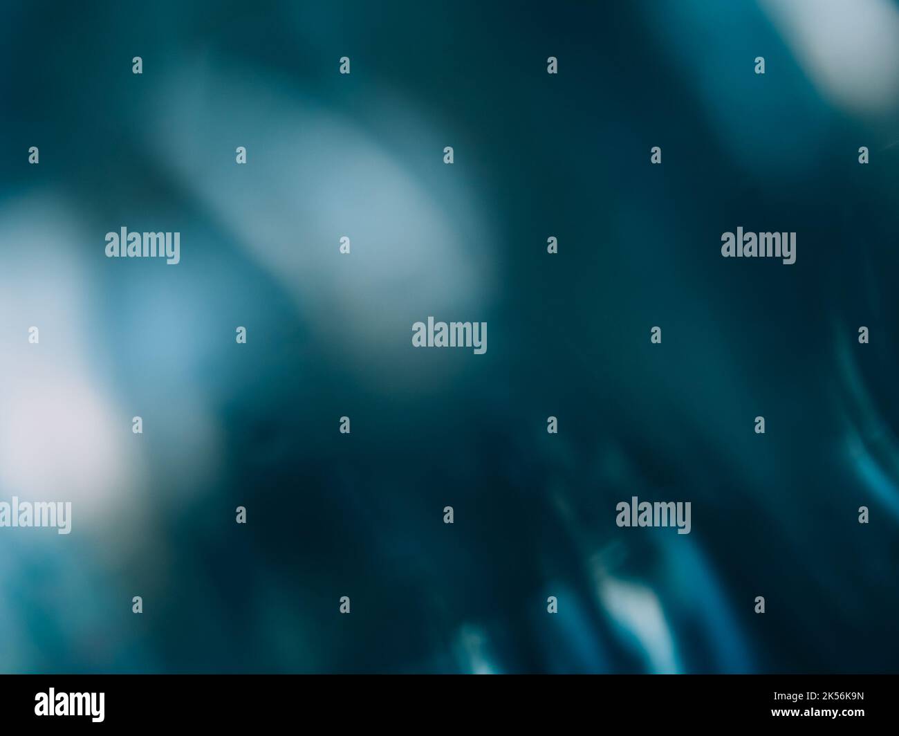 defocused glow background light flare teal blue Stock Photo - Alamy