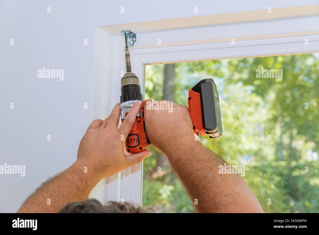 The fastenings are screwed into place by a professional technician as ...