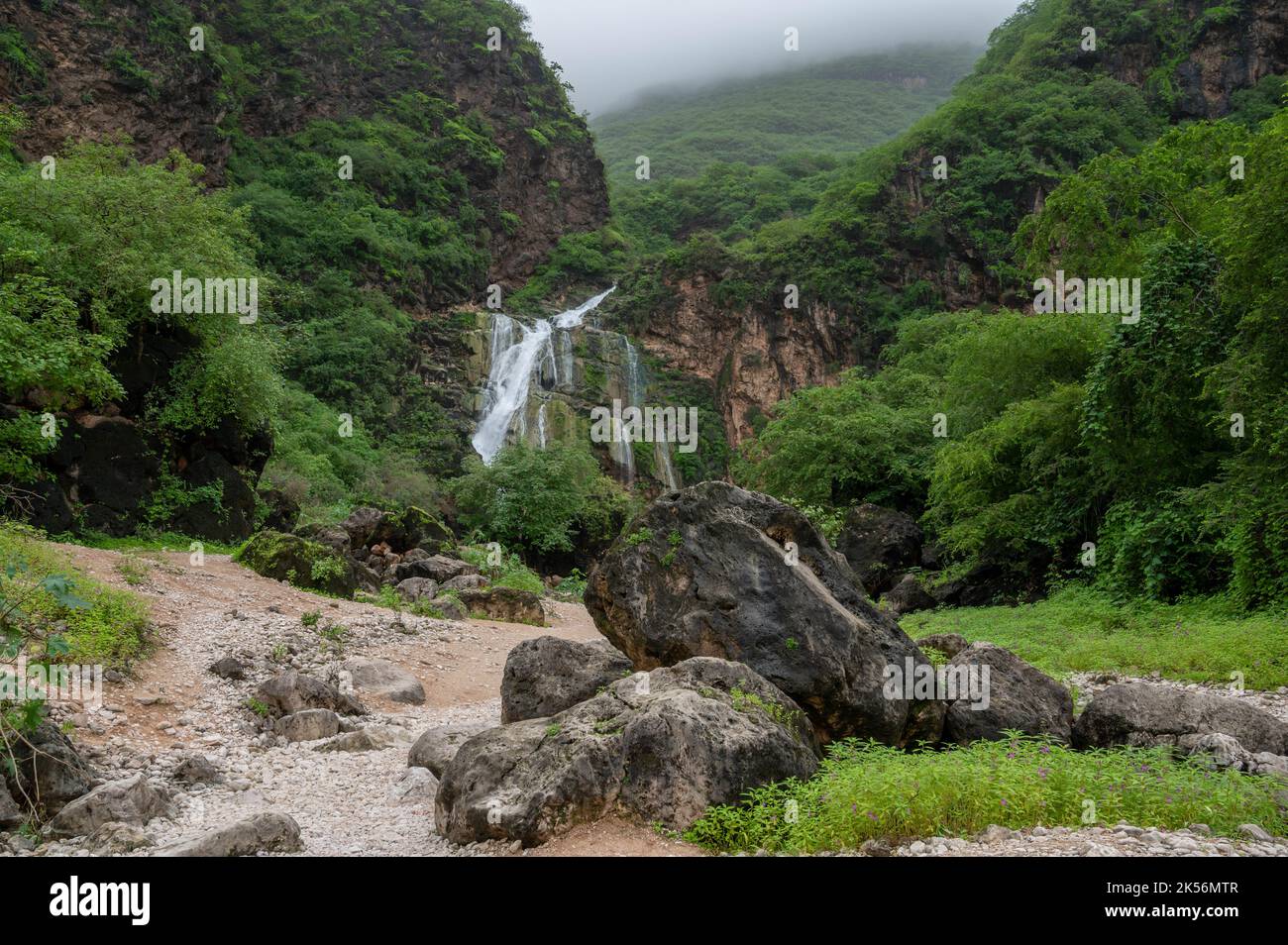 Ayn Khor during the autumn rainy season or khareef. Waterfall and ...