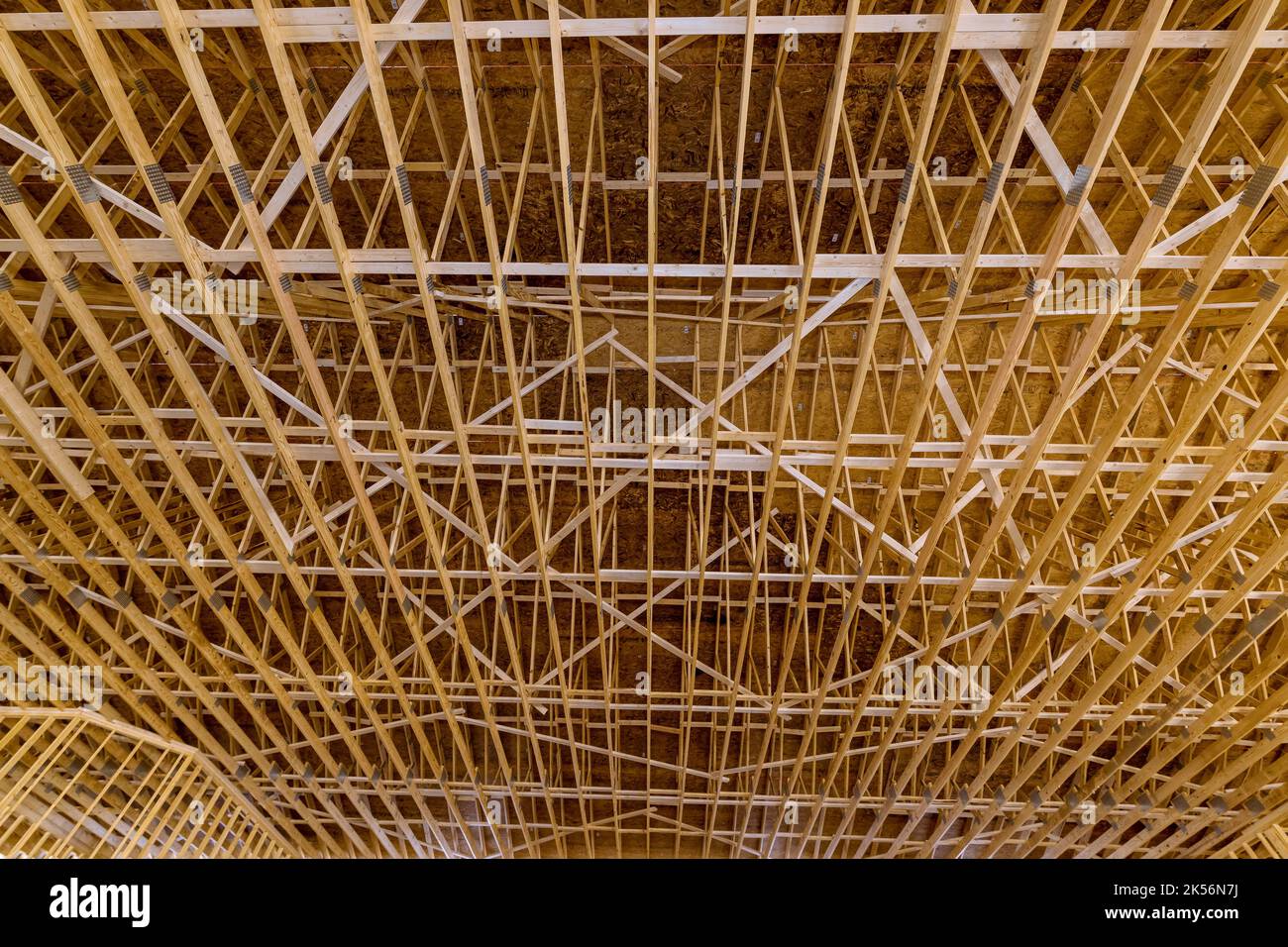 As of now, a wooden truss roof beam is being constructed for a new ...