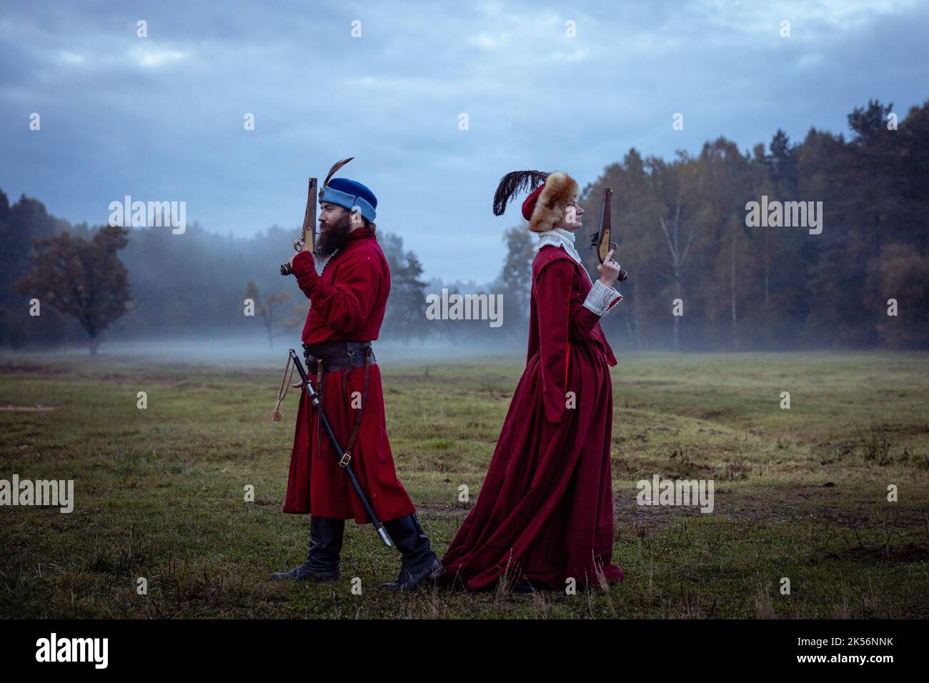 Duel between a man and a woman dressed in 17th century clothing ...