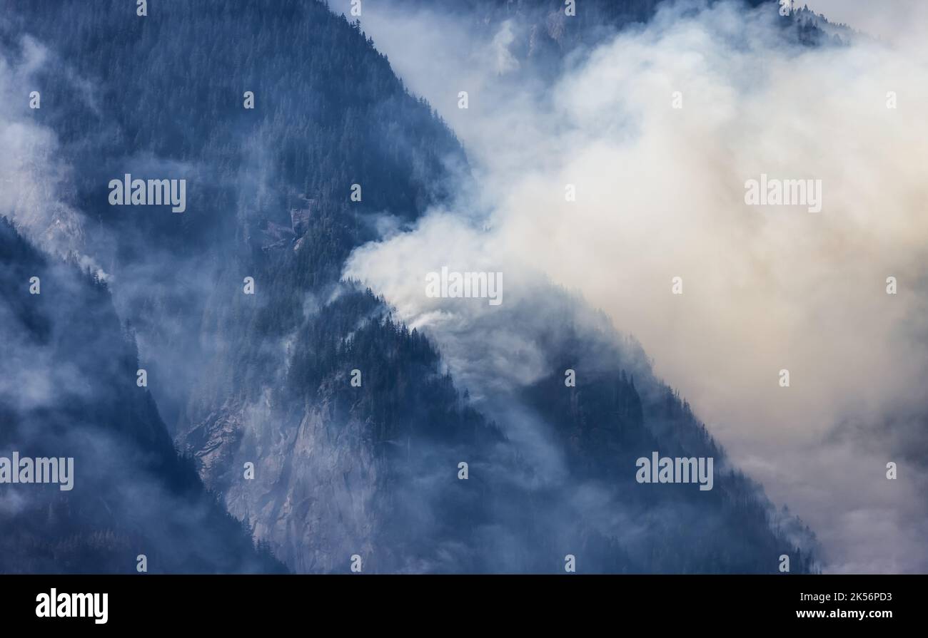 BC Forest Fire and Smoke over the mountain near Hope during a hot sunny ...