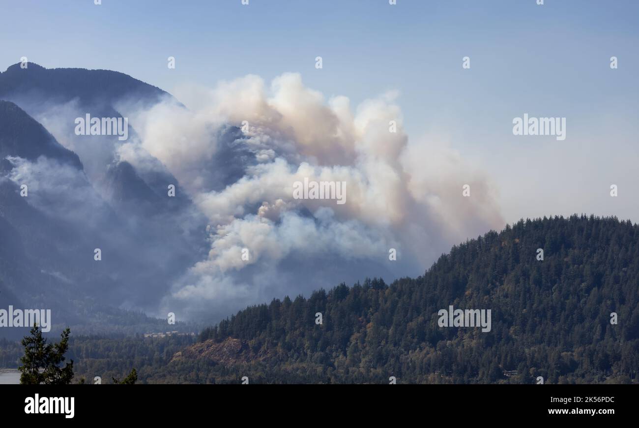 BC Forest Fire and Smoke over the mountain near Hope during a hot sunny ...