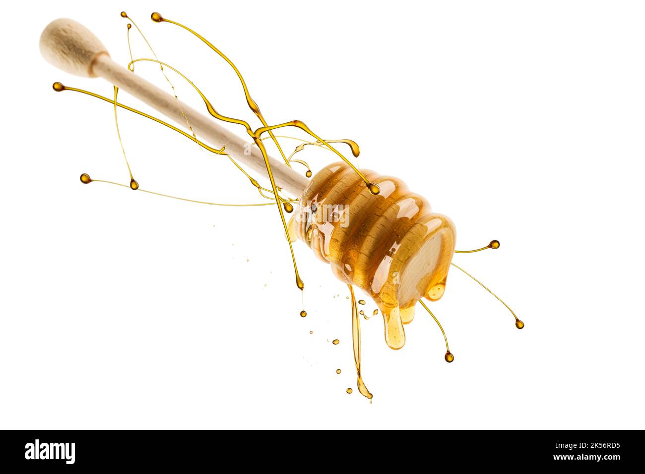 Honey dripping from wooden dipper with splash, isolated on white Stock ...