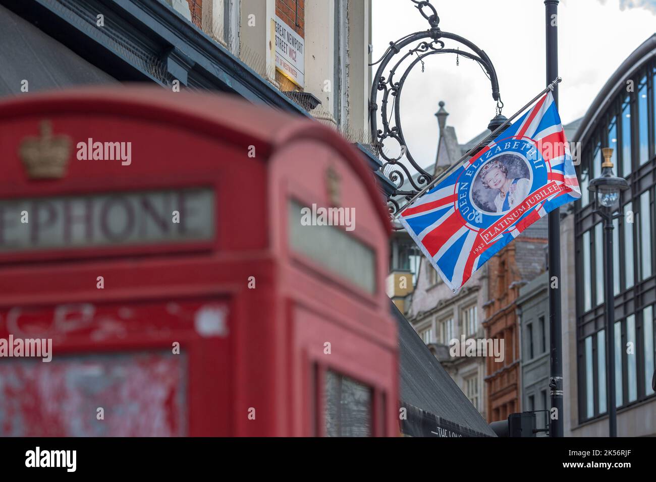 A Union flag featuring a portrait of Britain’s Queen Elizabeth II is ...
