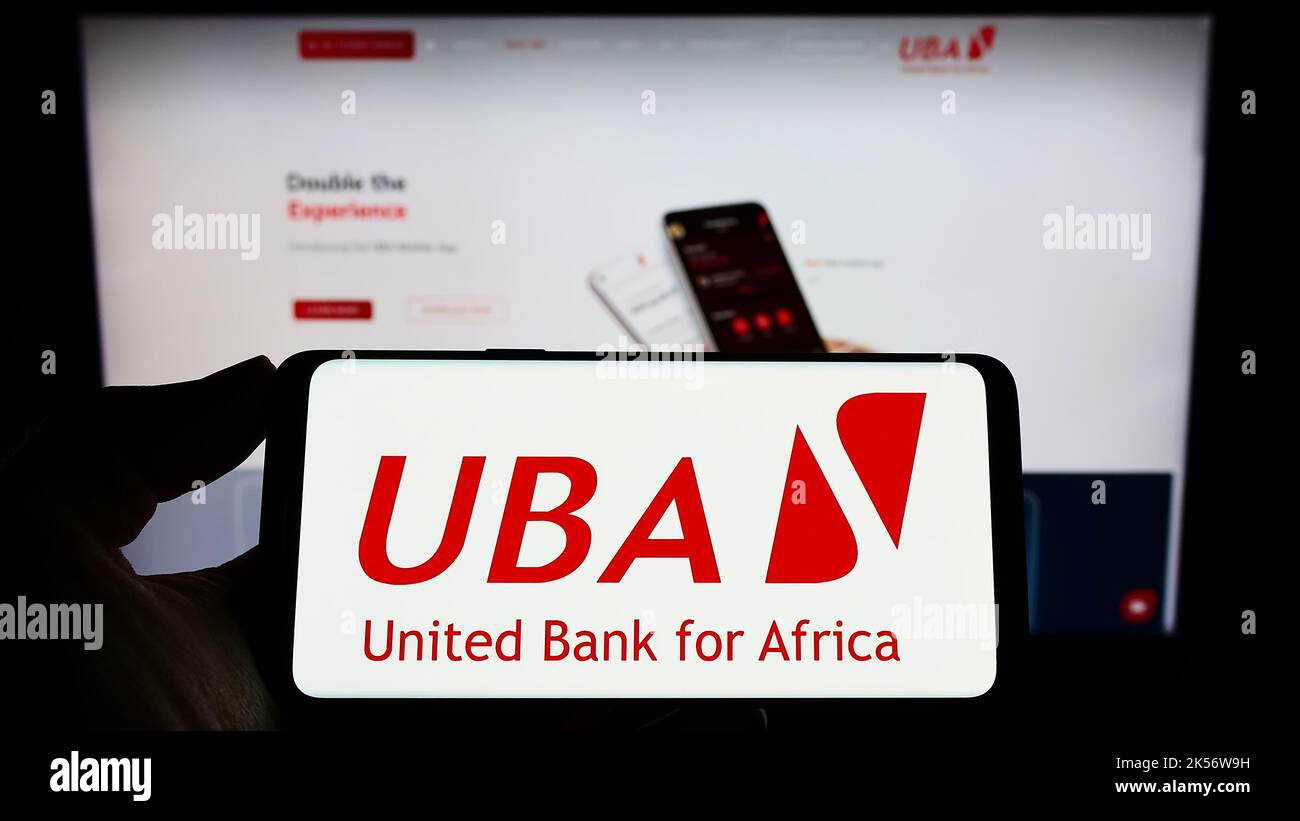 Person holding cellphone with logo of company United Bank for Africa ...