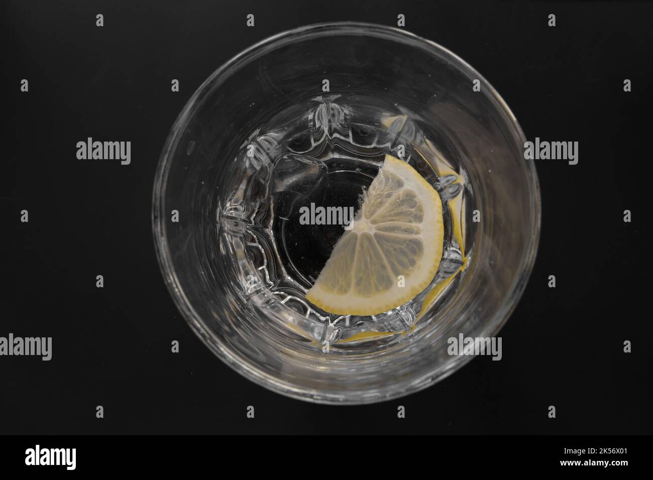 Summer refreshing drink on the rocks with lemon slice . View from above ...