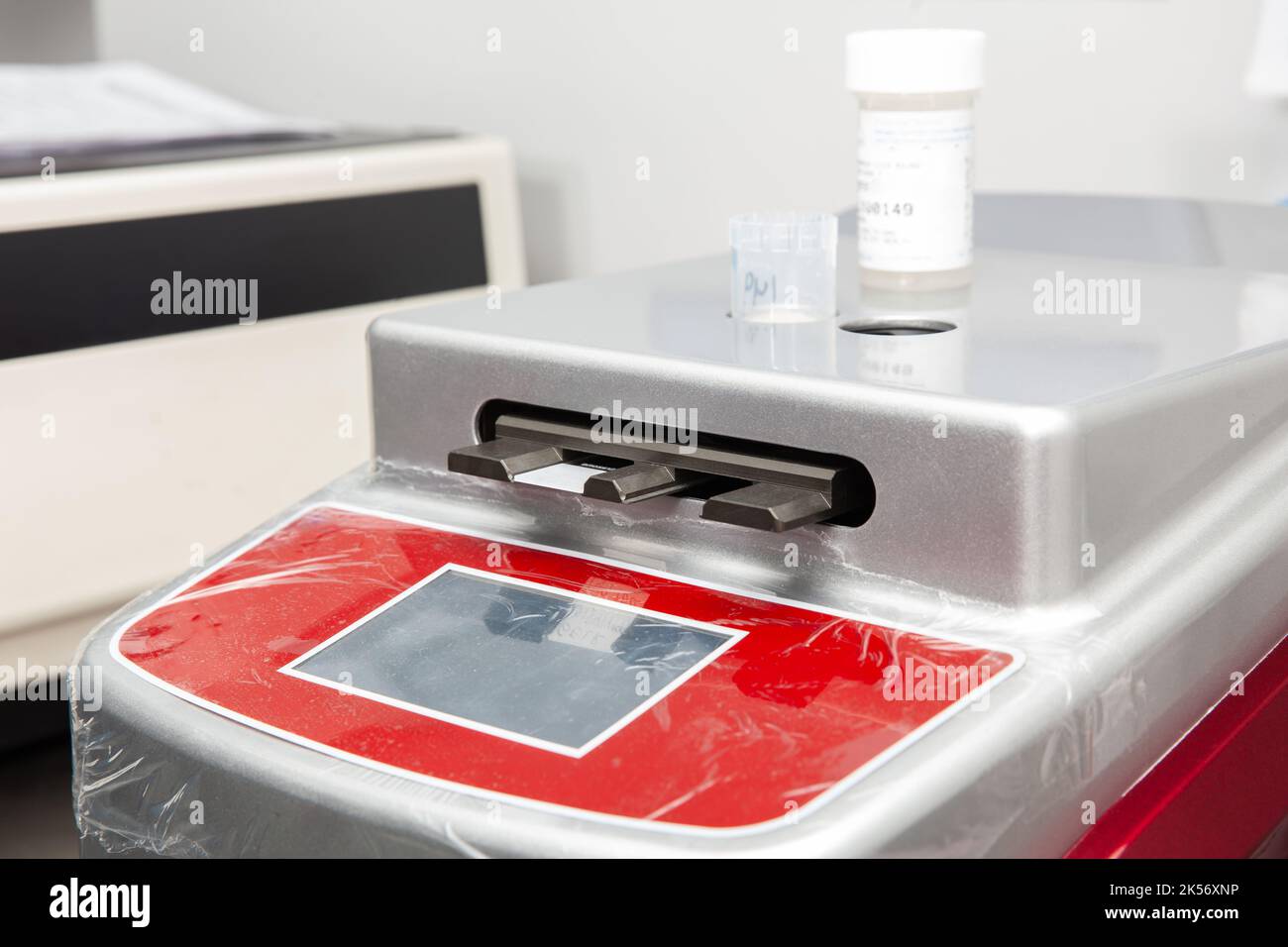 Scientist preparing microscope slides with liquid based cytology method ...