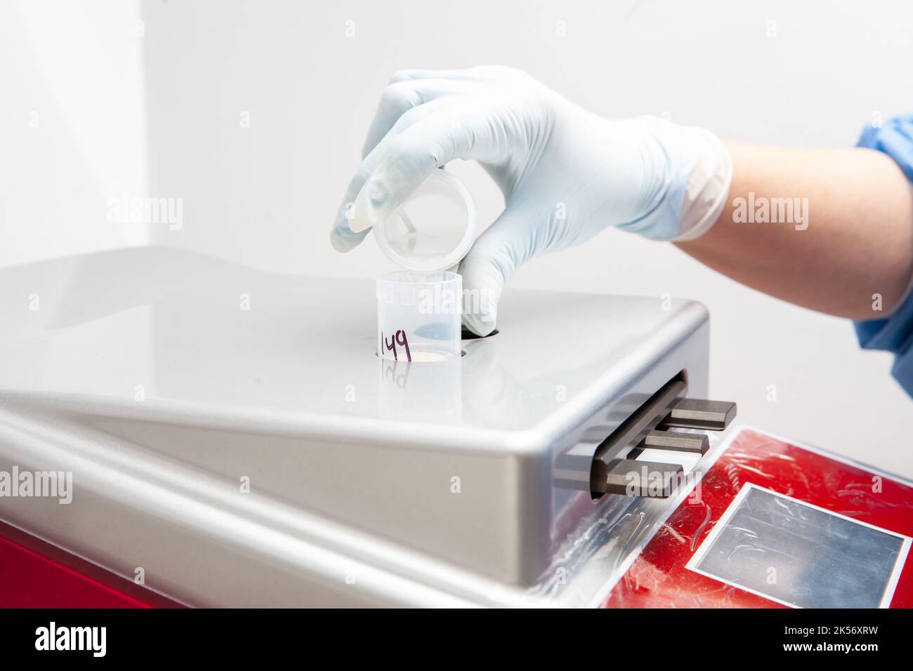 Scientist preparing microscope slides with liquid based cytology method ...