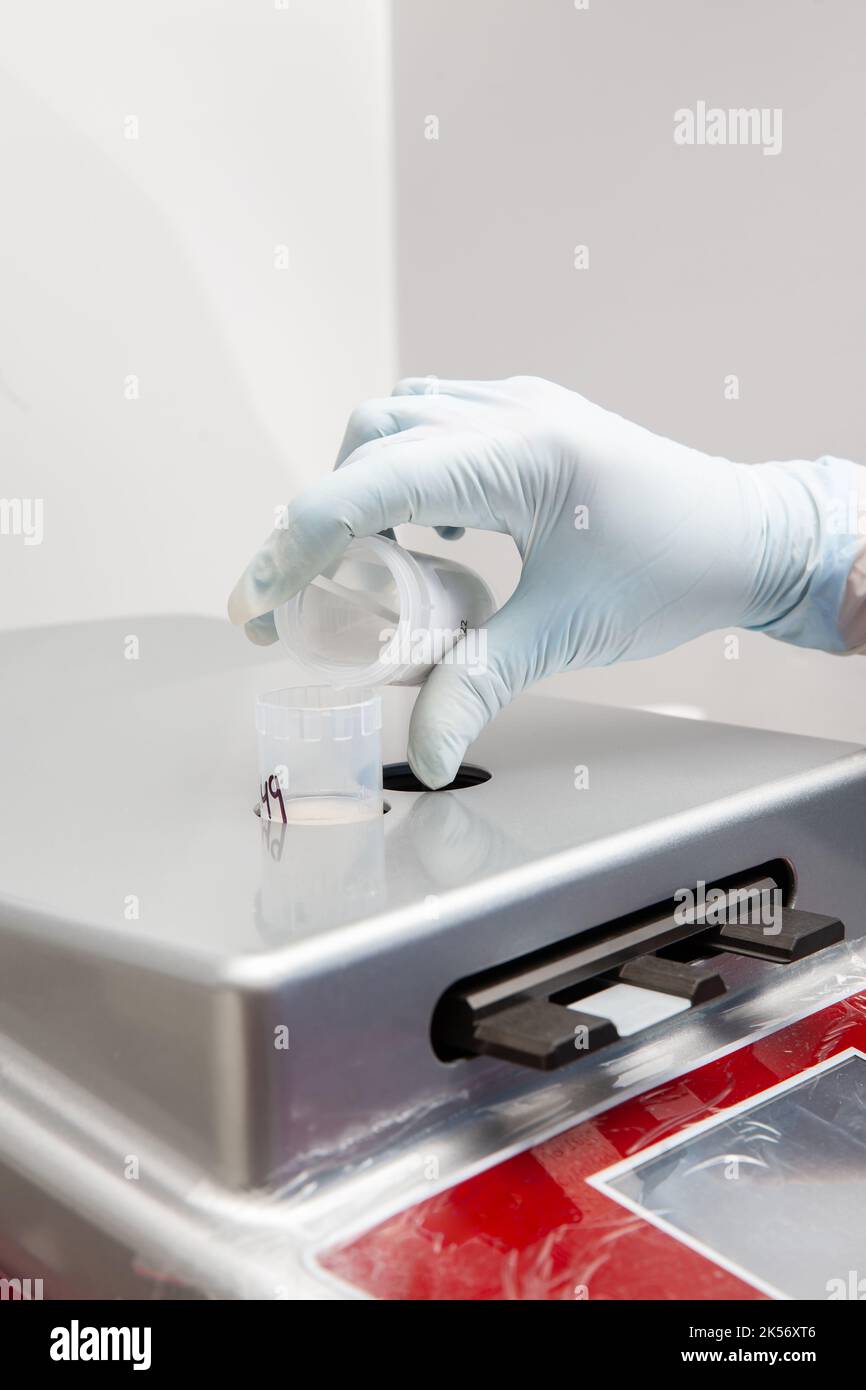 Scientist preparing microscope slides with liquid based cytology method ...