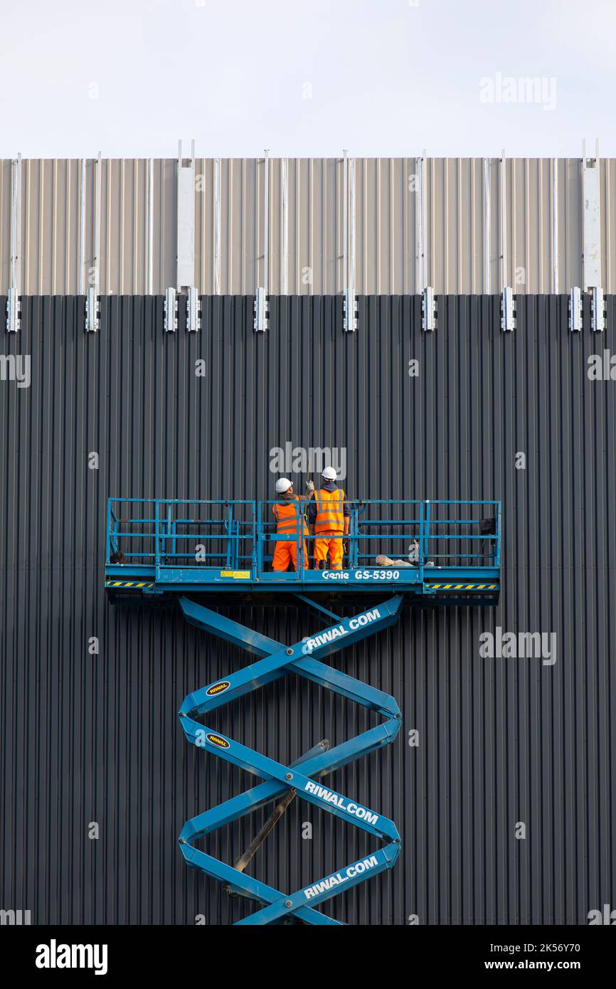 Worked installing cladding on industrial building using scissor lift ...