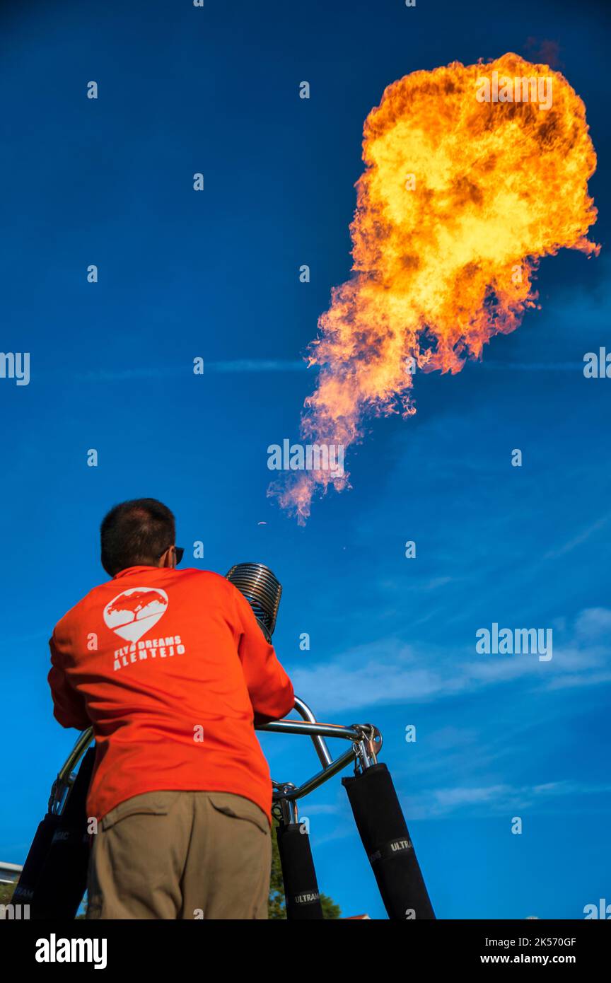 fire ball agaisnt blue sky from a ballon burner Stock Photo - Alamy