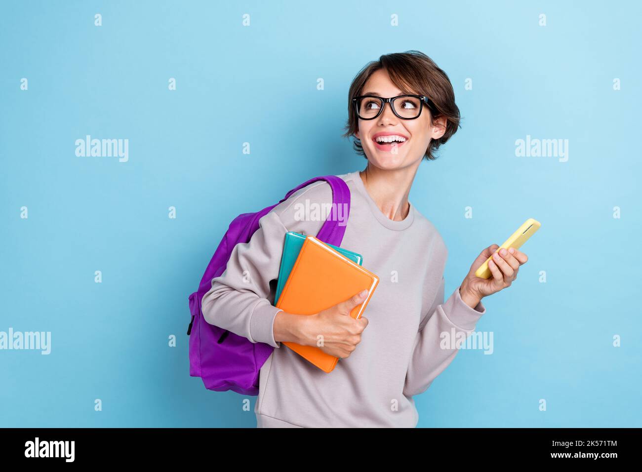 Photo of satisfied stylish lady hold bag telephone planner wear glasses ...