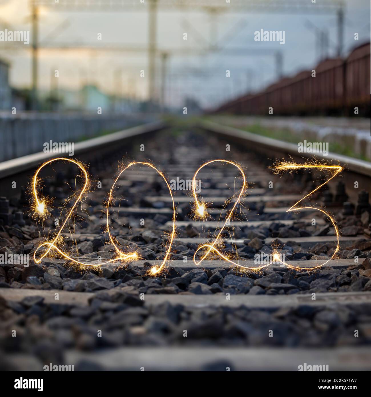 Happy New Year 2023. Number 2023 written sparkling sparklers on railway ...