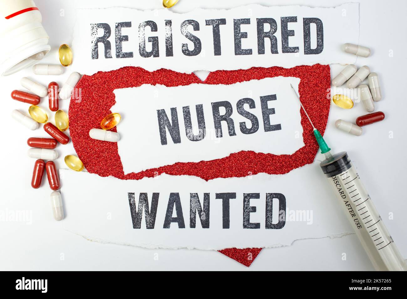 Registered Nurse wanted written with stamp letters on ripped white ...
