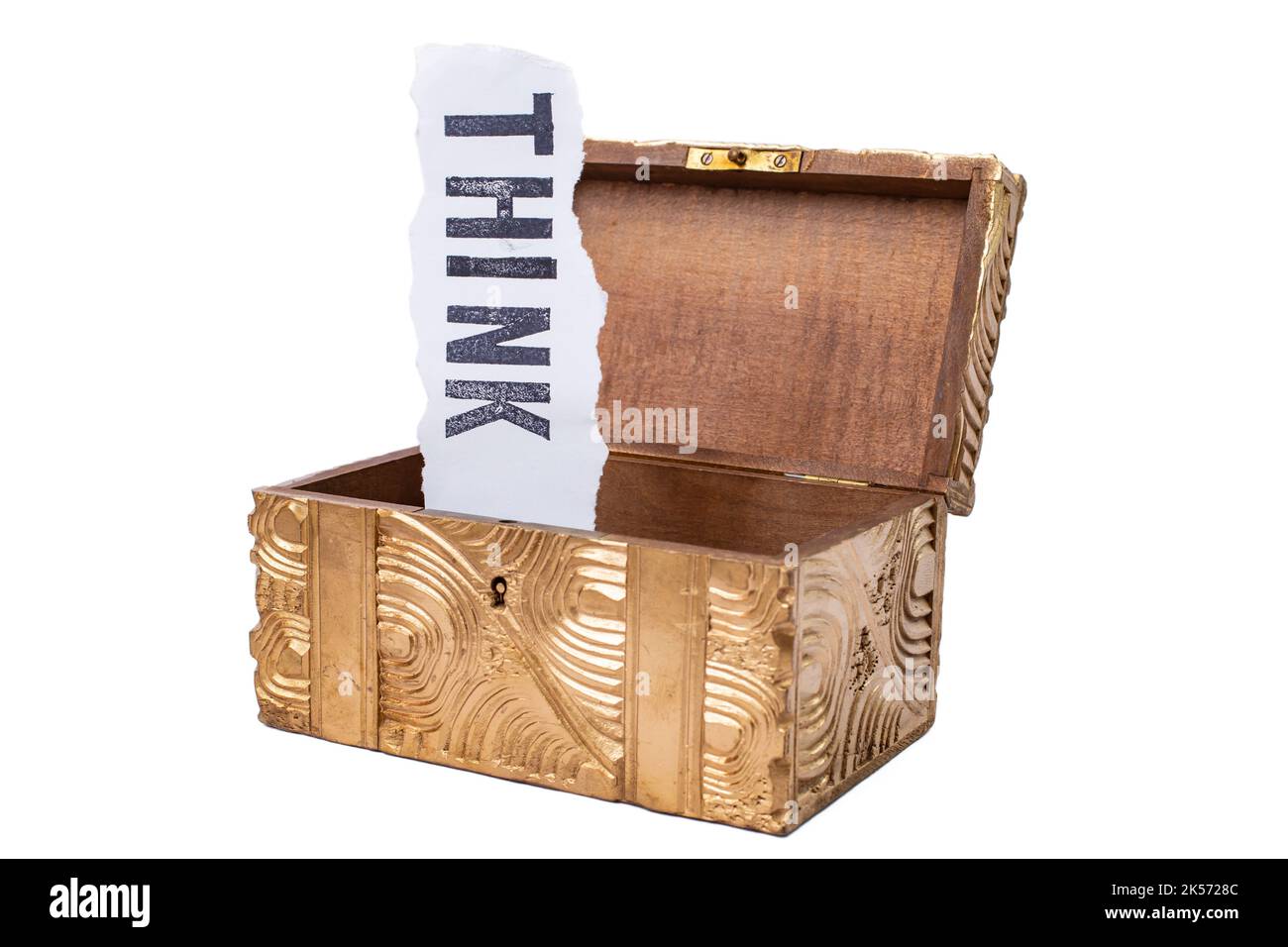 Think, written on a ripped piece of white paper, coming out of a golden ...