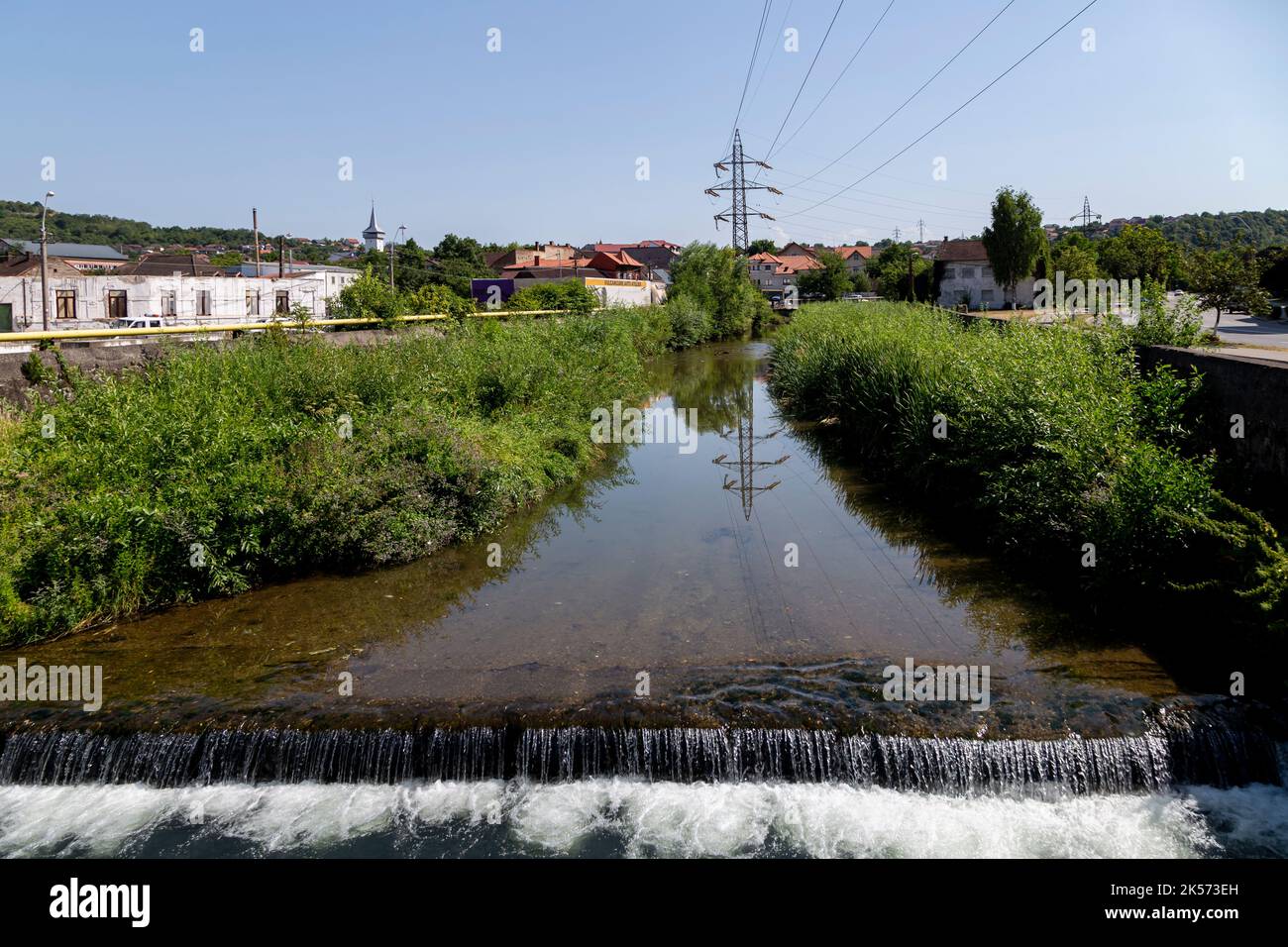View of the Cerna river passing through the city of Hunedoara ...