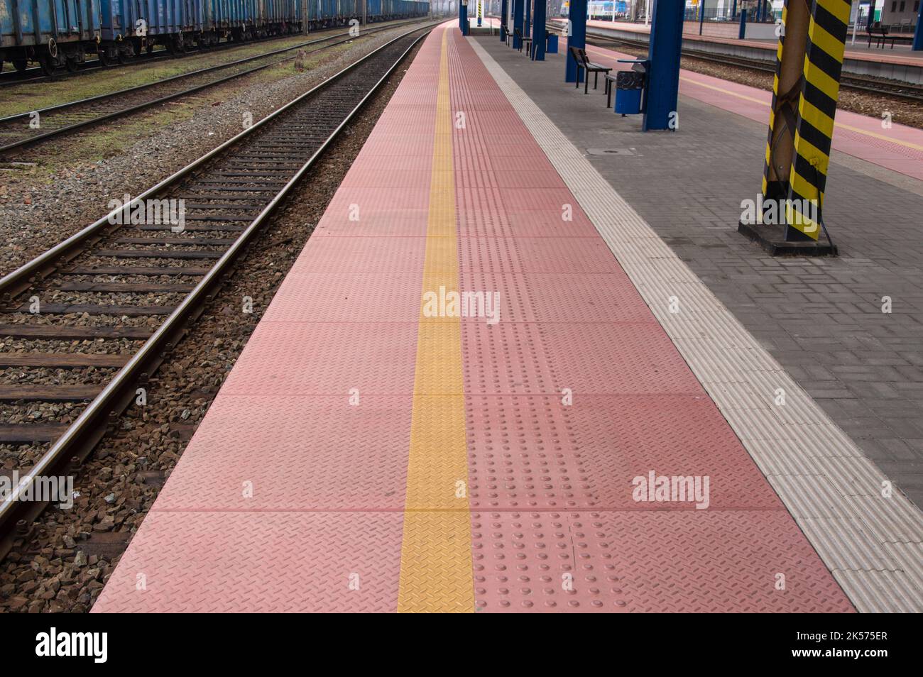 Railway platform without passengers at the railway station seen from a ...