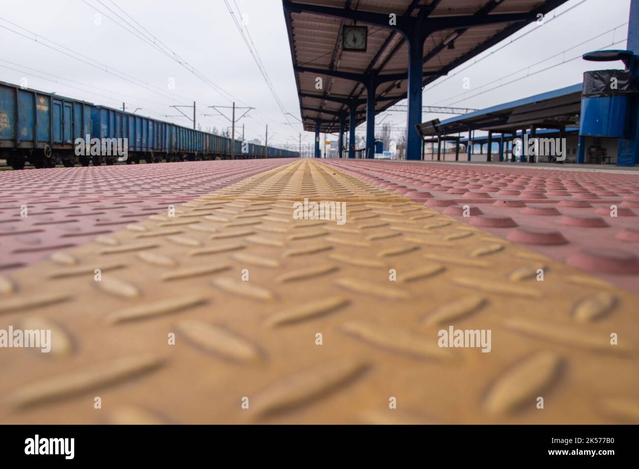 Railway platform without passengers at the railway station seen from a ...