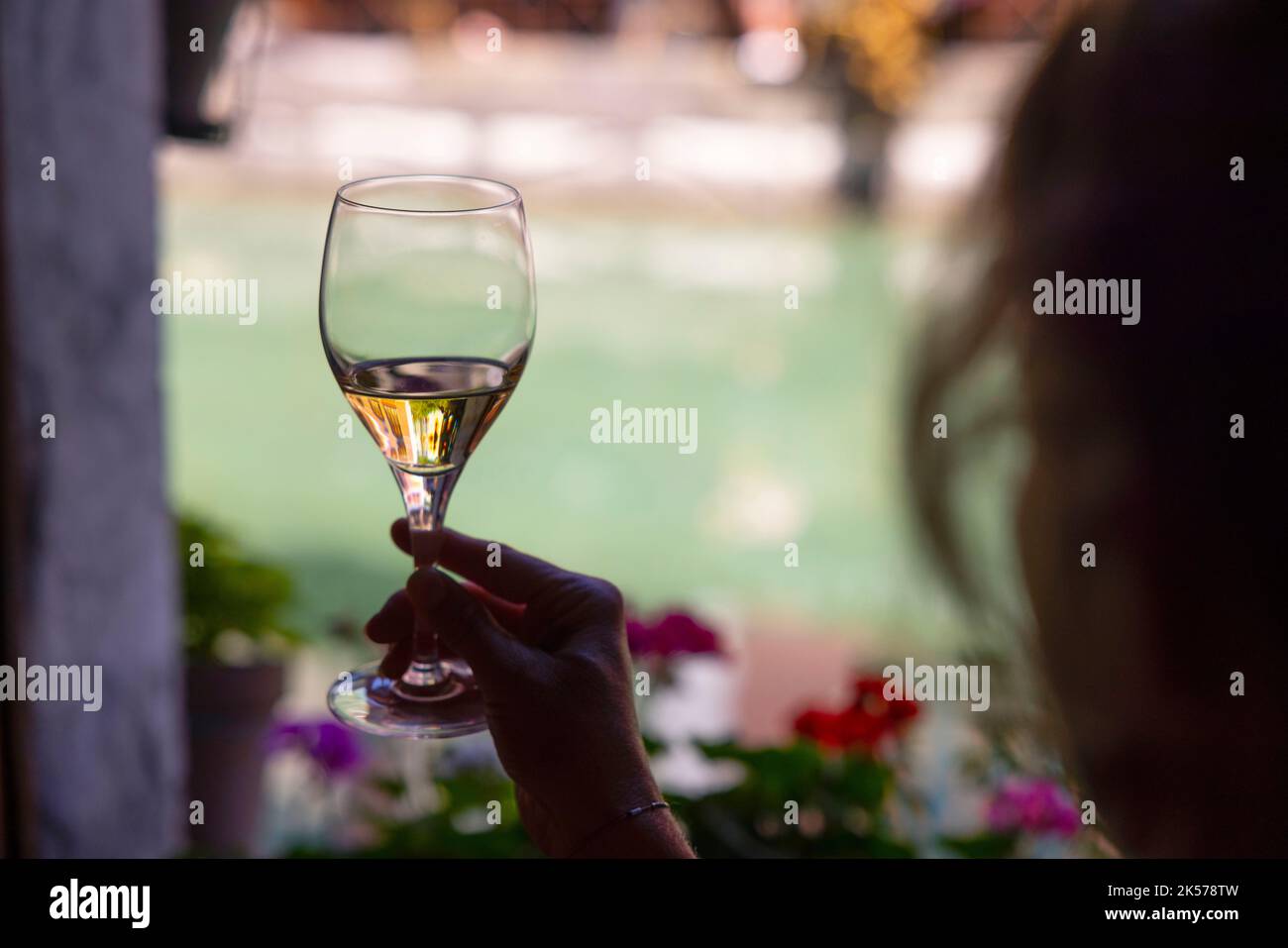 France, Haute-Savoie (74), Annecy , A glass of Savoie wine in the ...