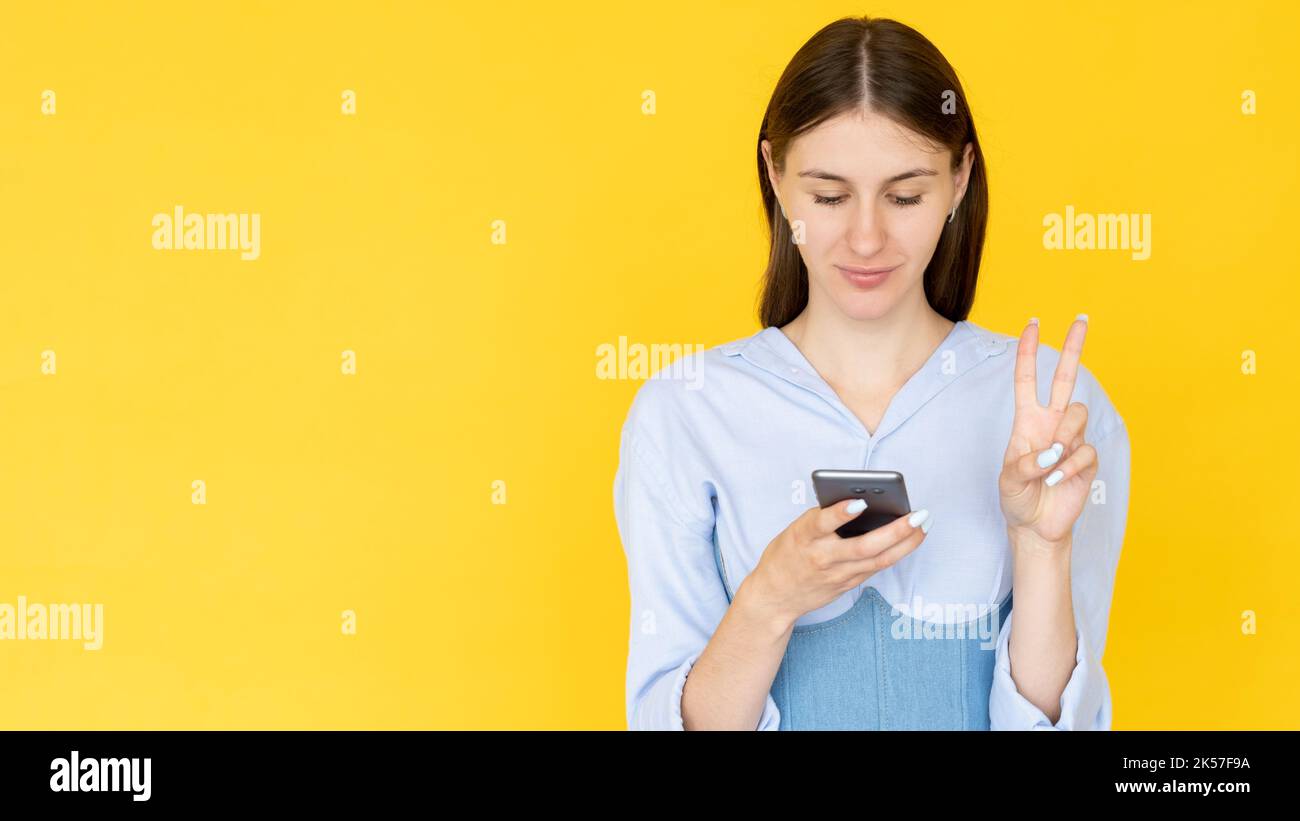 online communication positive woman peace gesture Stock Photo - Alamy