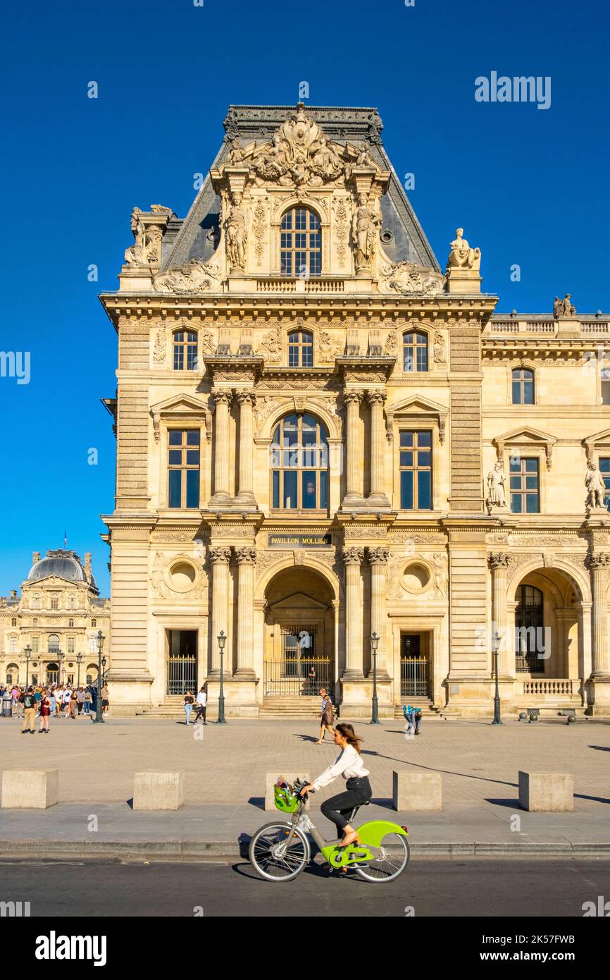 France, Paris, Louvre museum, Mollien pavilion and the pyramid, cyclist ...