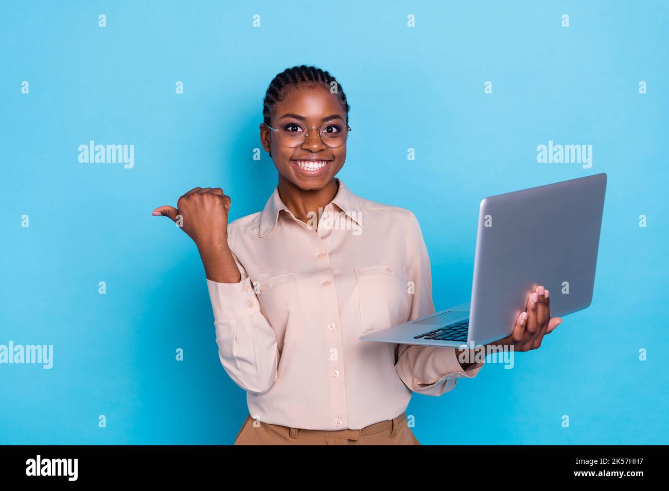 Photo of charming intelligent stylish female worker surfing in netbook ...